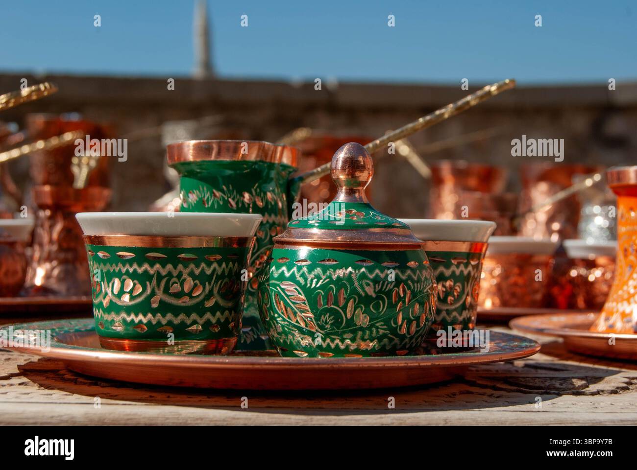 Traditional Turkish copper coffee pot with a green patina and matching ...