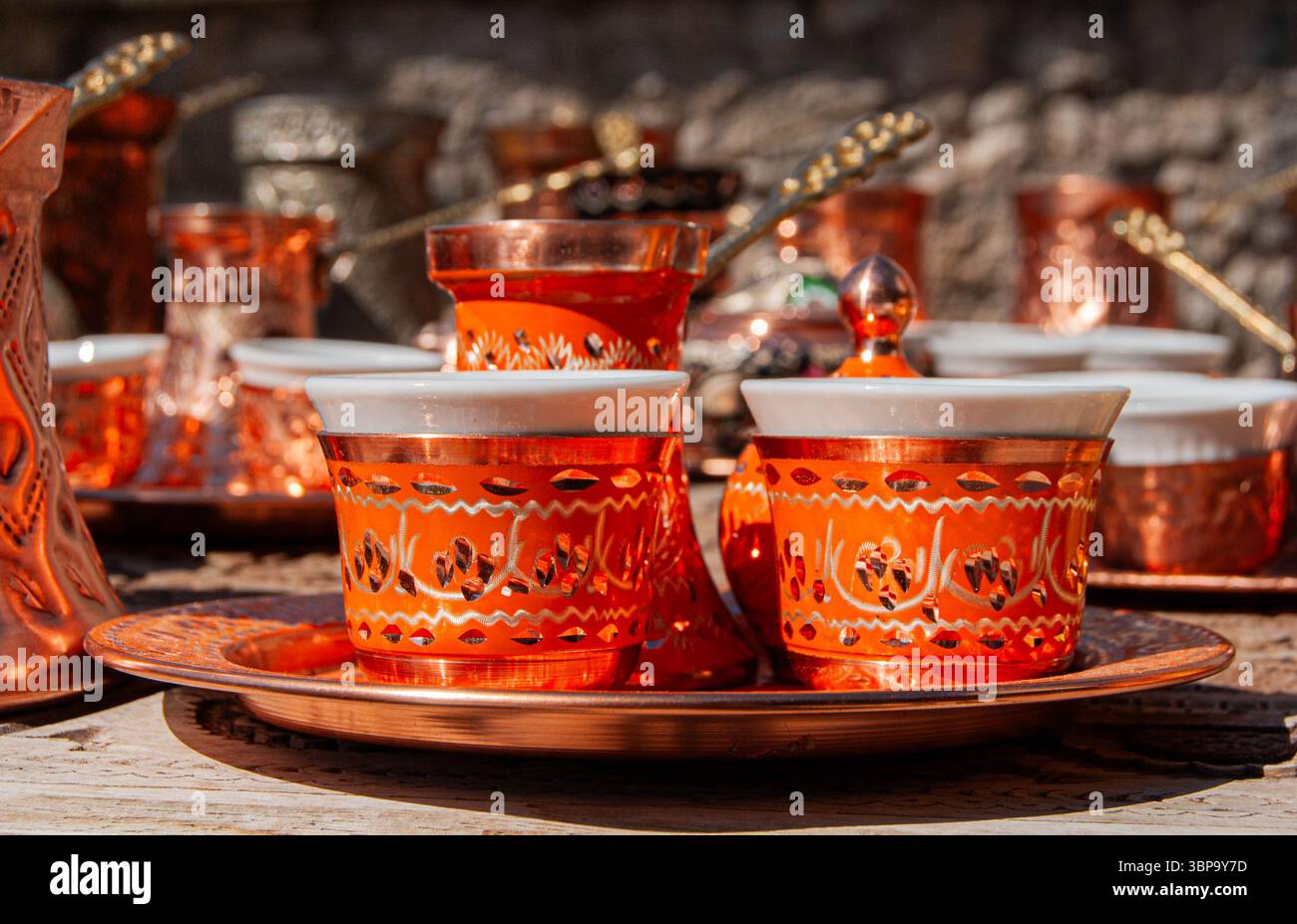 Traditional Turkish copper bowl with a shiny gold finish, reflecting ...