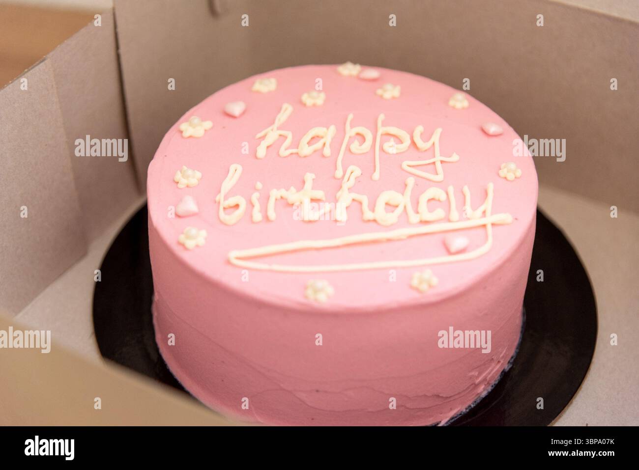 Pink house made cake with an inscription message for the birthday of ...