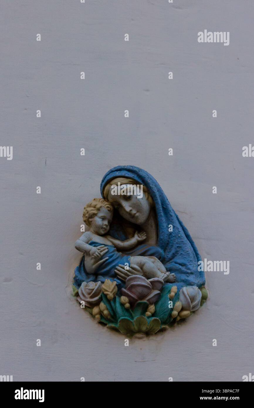 Statue Depicting a Mother and Child in an Artistic and Religious Style ...