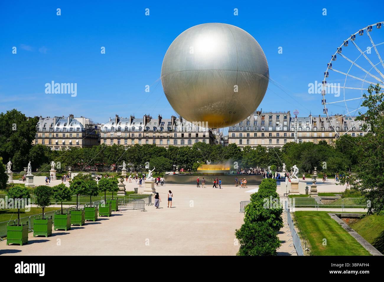 Olympic Cauldron suspended under a silver tethered balloon in the ...
