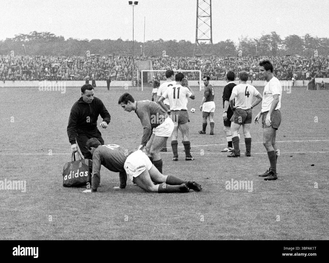 Sport football injured photo Black and White Stock Photos & Images - Alamy