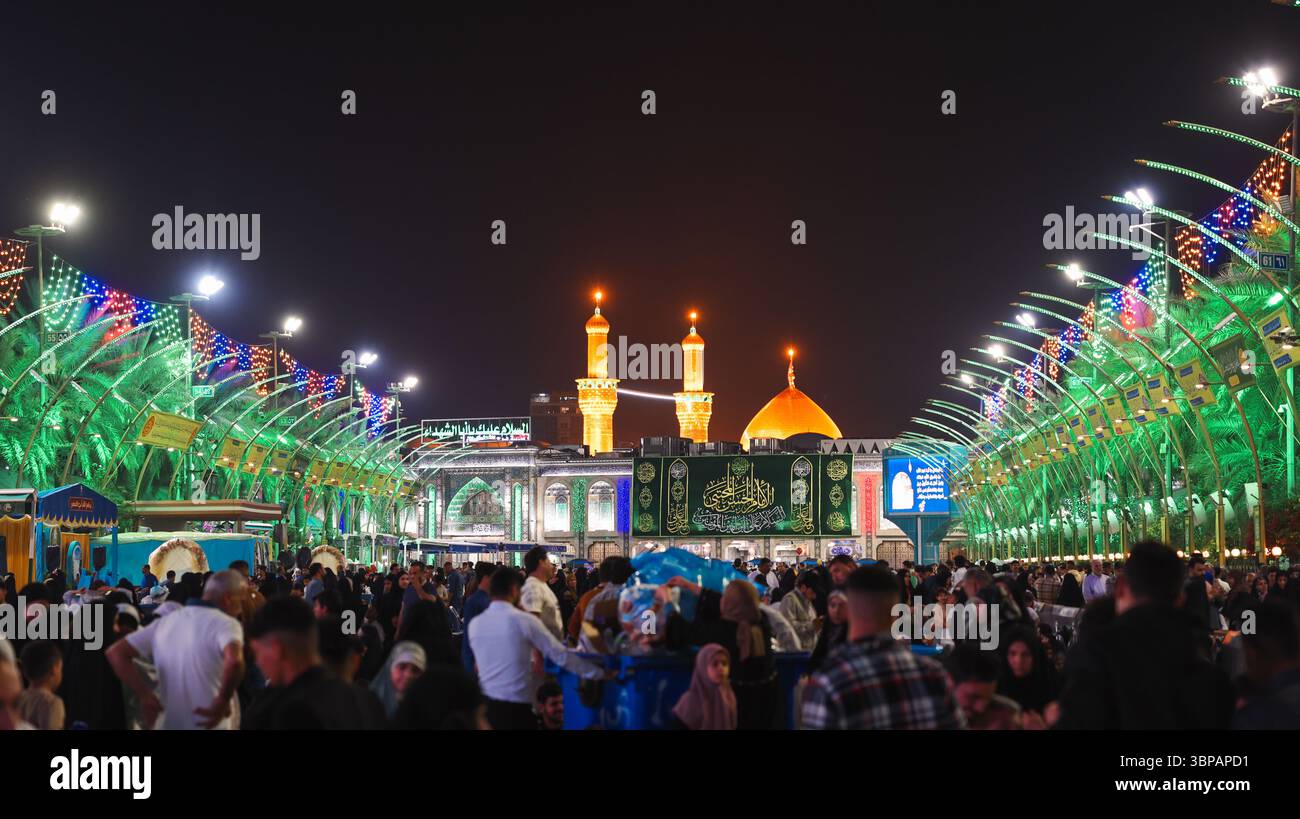 Crowds fill the illuminated streets of Karbala, Iraq, celebrating with ...