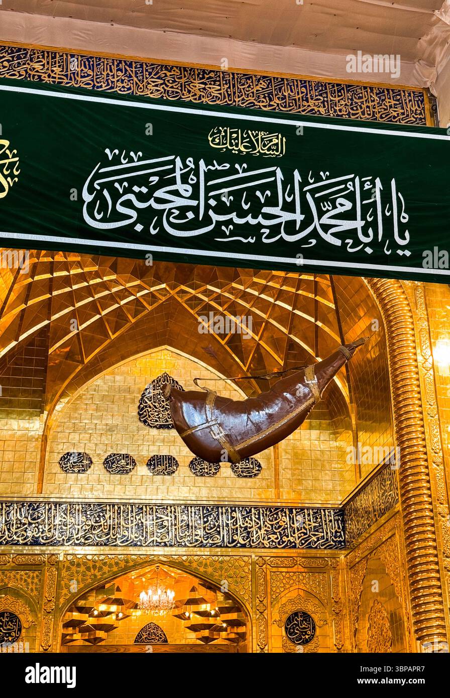 Visitors pay homage at the ornate shrine of Imam Hussein in Karbala ...