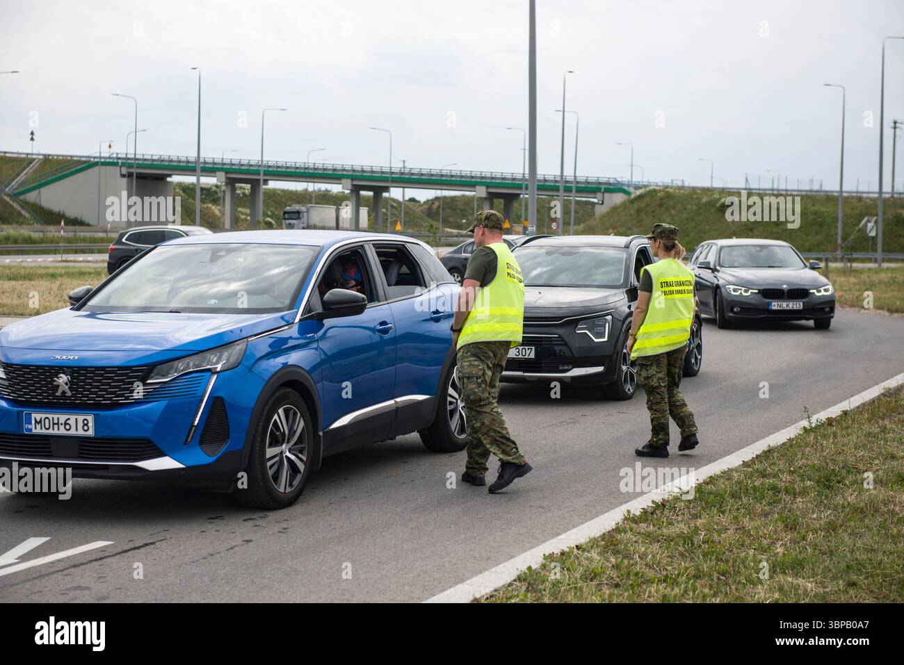 Polish border guards perform controls of vehicles at the checkpoint ...