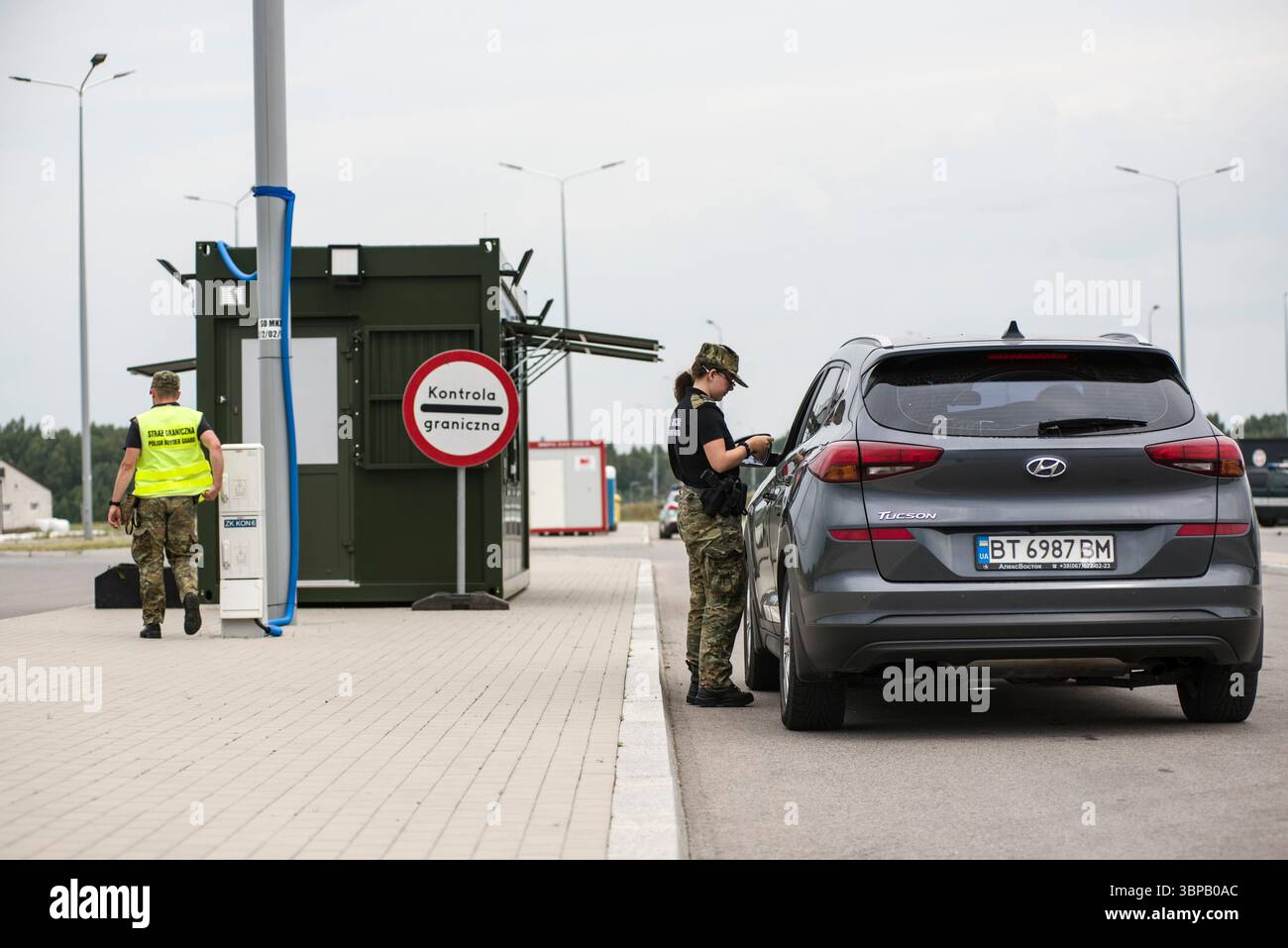 Polish border guards perform controls of vehicles at the checkpoint ...