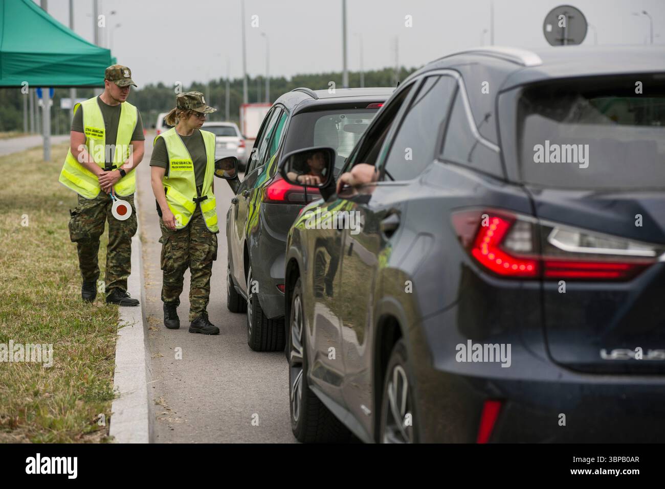 Polish border guards perform controls of vehicles at the checkpoint ...