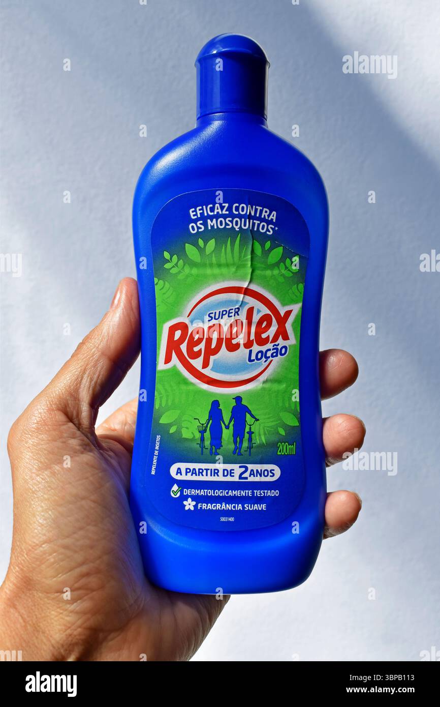 RIO DE JANEIRO, BRAZIL - June 30, 2025: Hand holding a bottle of insect ...