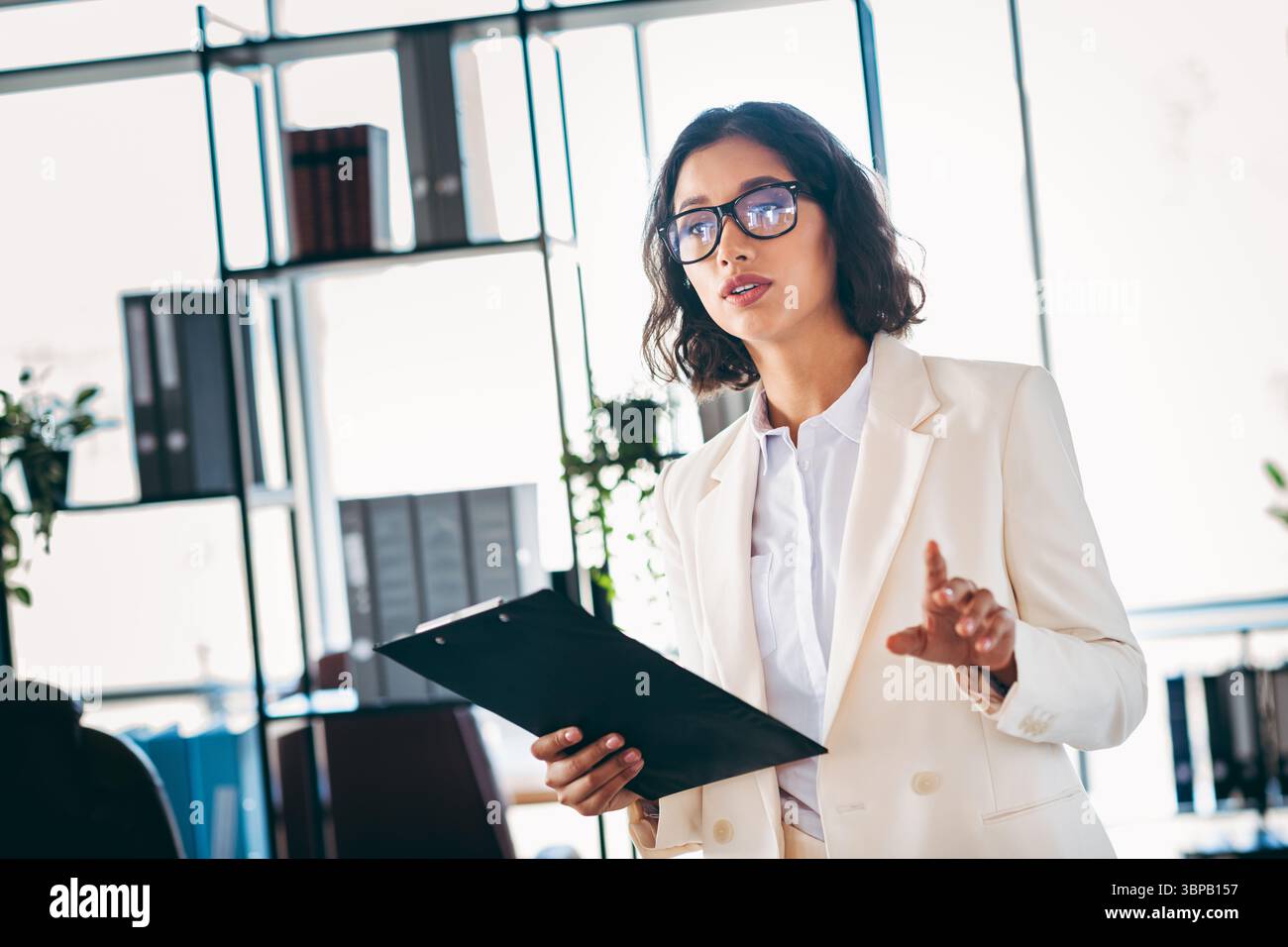 Woman assistant presenting report chief hi-res stock photography and ...