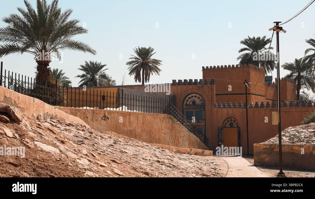 Visitors explore the ancient ruins of Babylon in Iraq, surrounded by ...
