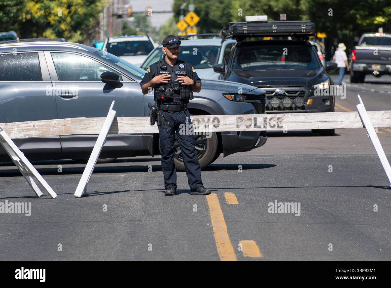 Provo, UT – July 4, 2025: A Provo police officer stands in the middle ...