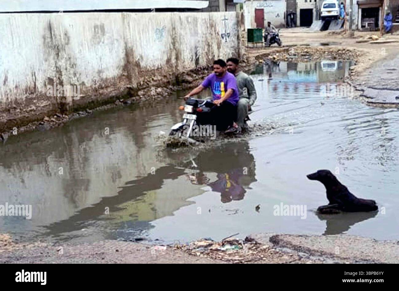Hectic street full of garbage, sewerage water, causing unhygienic ...