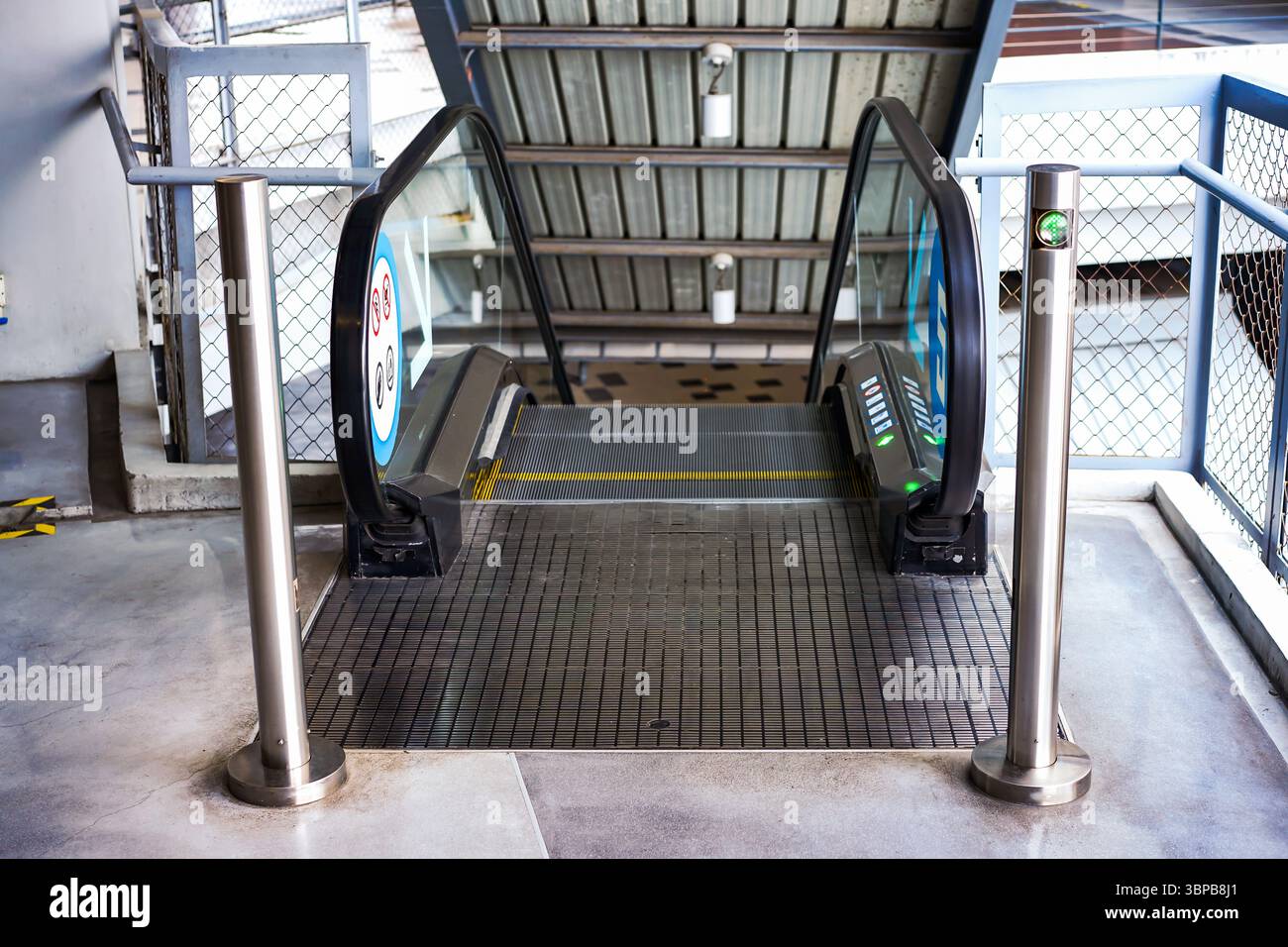 LED green light arrow Signage stainless pole in front of escalator sign ...