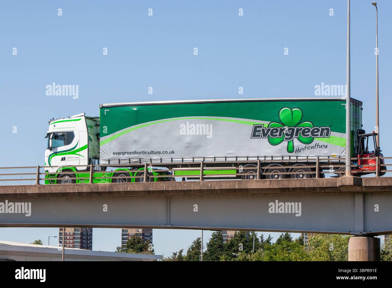 An Evergreen Horticulture articulated lorry with a curtain-sided ...