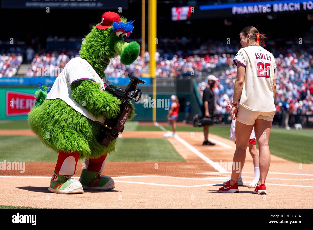 The Phillie Phonetic, left, plays with a video camera prior to a ...