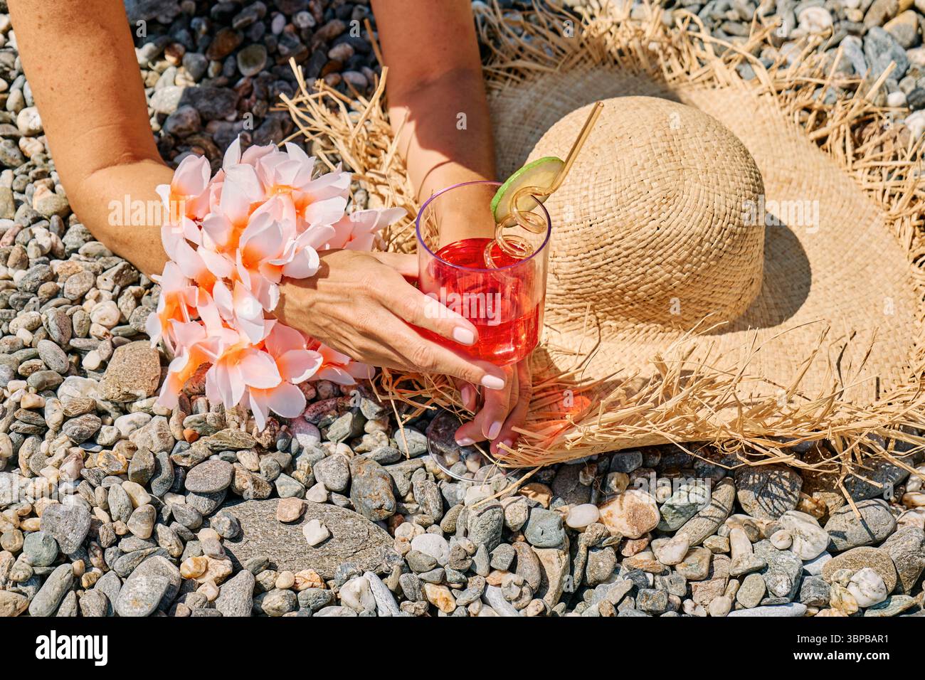Anonymous woman in bikini ad straw hat holding summer refreshing red ...