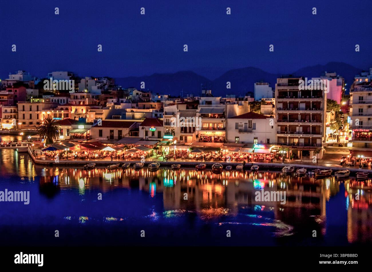 Colourful night-time scene at the holiday resort town of Rethymnon on ...