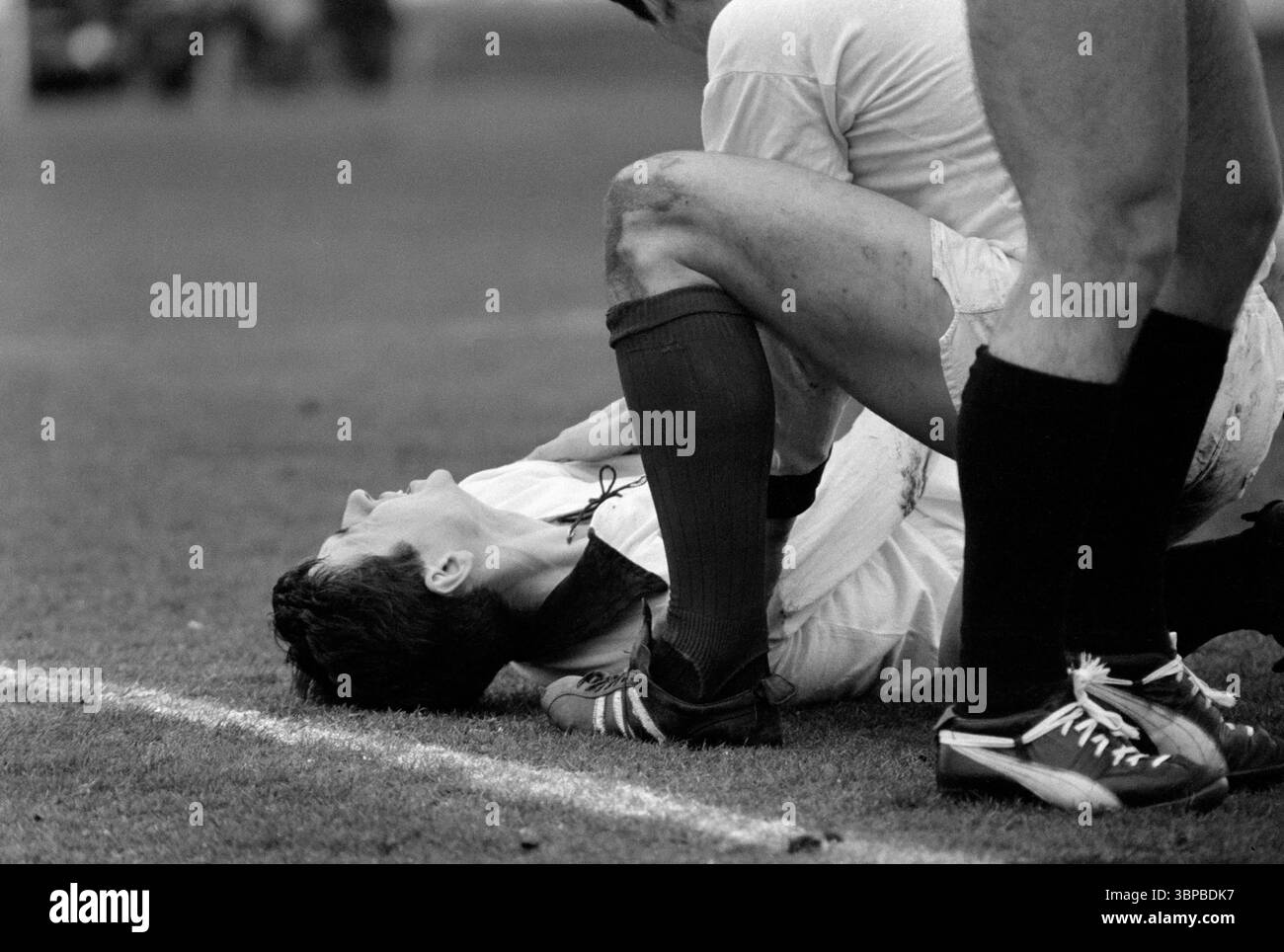 Sport football injured photo Black and White Stock Photos & Images - Alamy