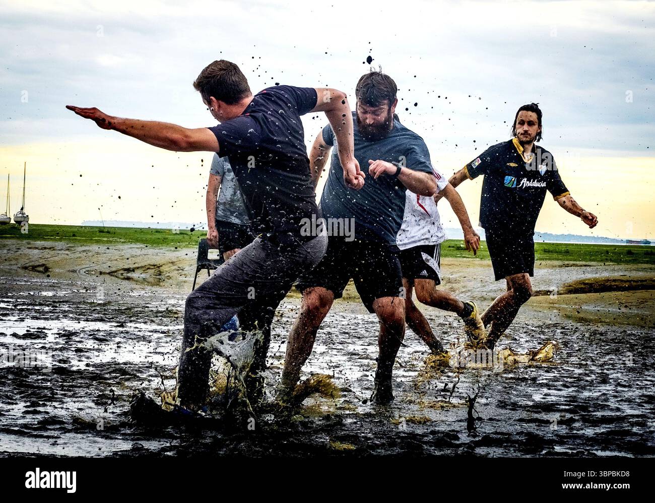 'Mud Football' - Football on the mud at the Old Leigh Regatta, Leigh on ...