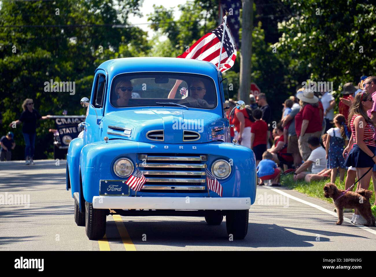 Antique Ford truck with American flags in July 4th parade Stock Photo ...