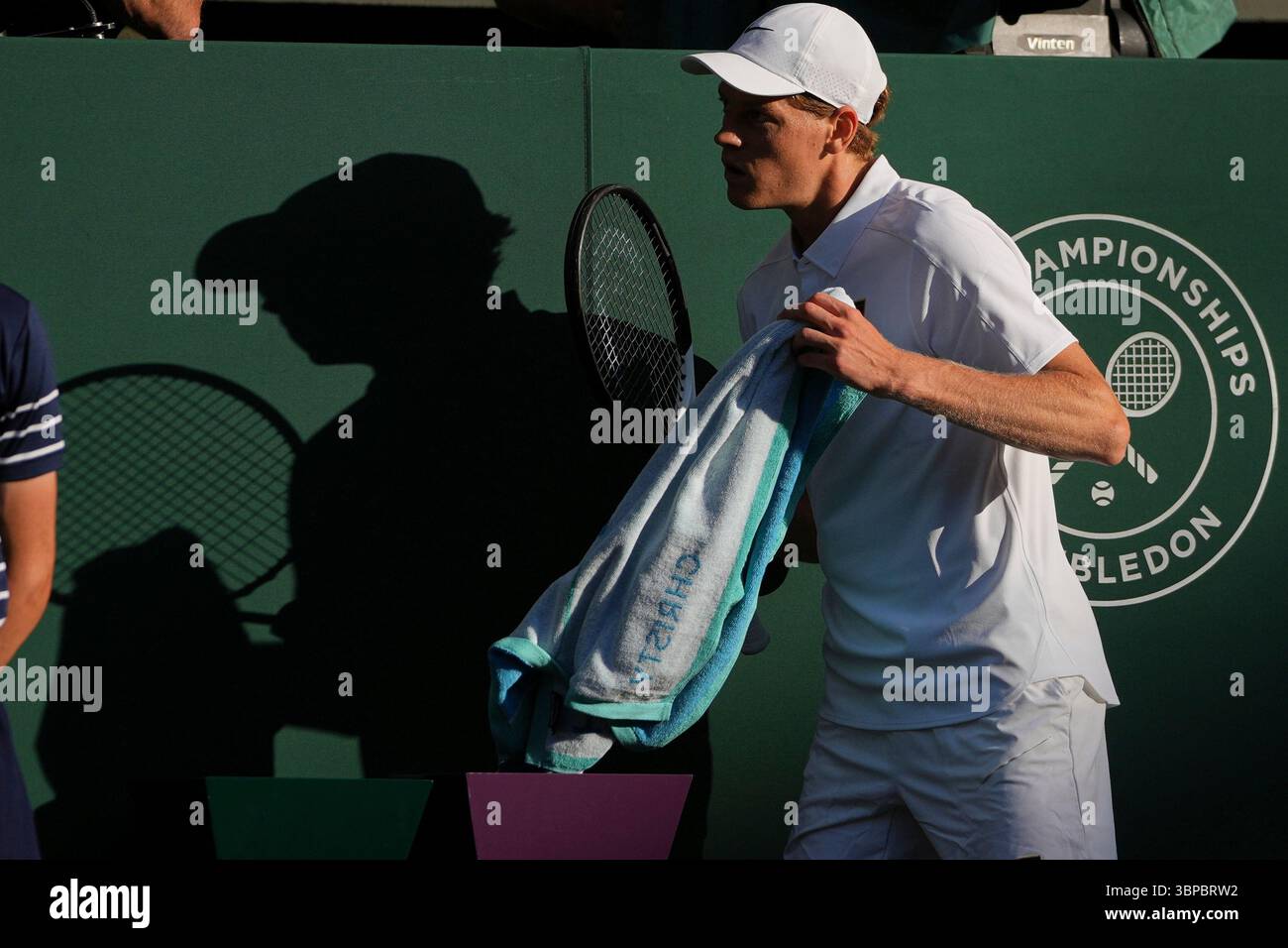 Italy's Jannik Sinner takes his towel between points as he plays ...