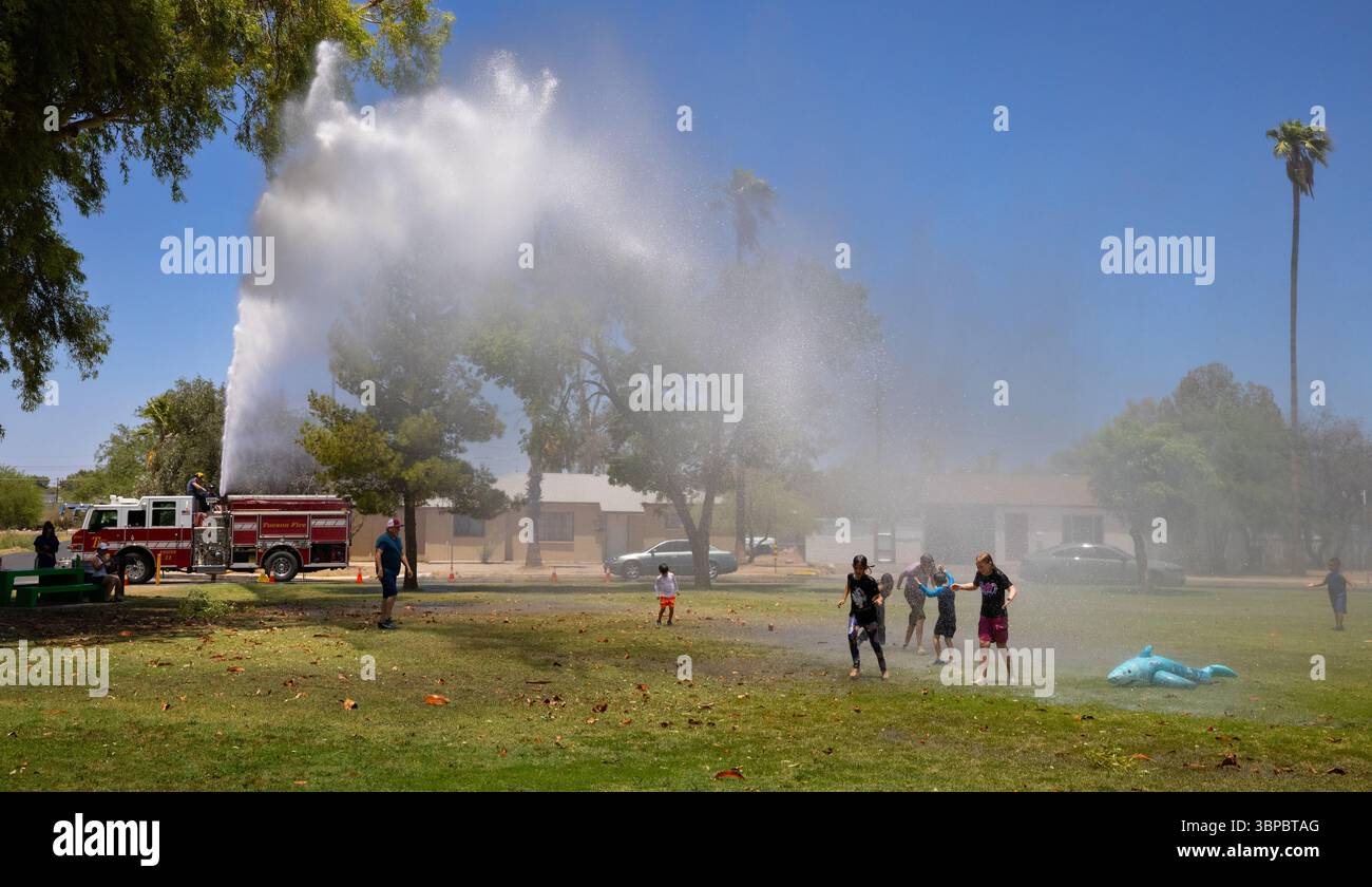 Children play fire hose public hi-res stock photography and images - Alamy