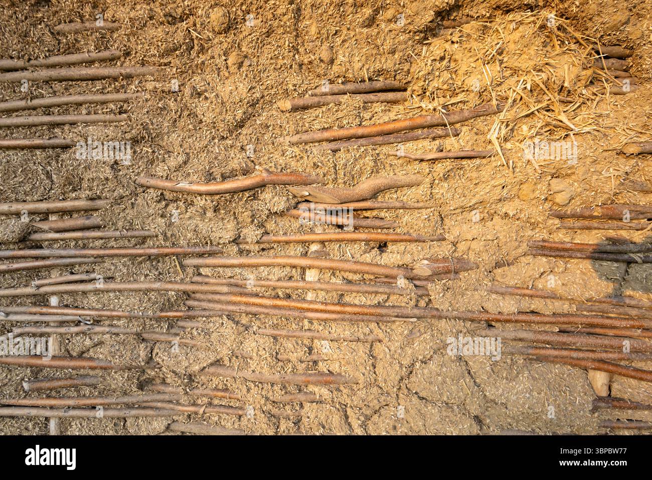 Close-up of a historic construction technique displaying an earthen ...