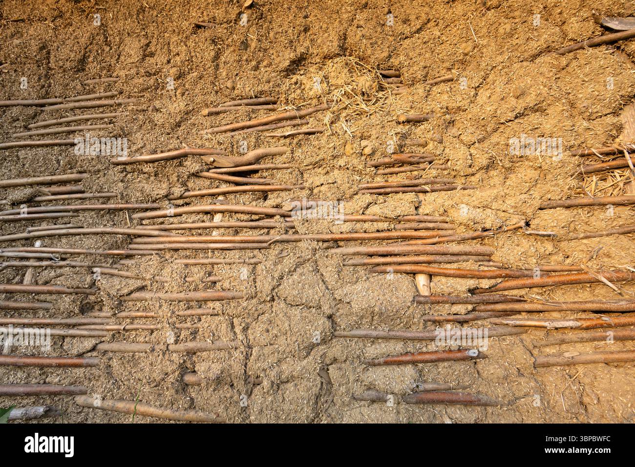 Close-up of a historic construction technique displaying an earthen ...