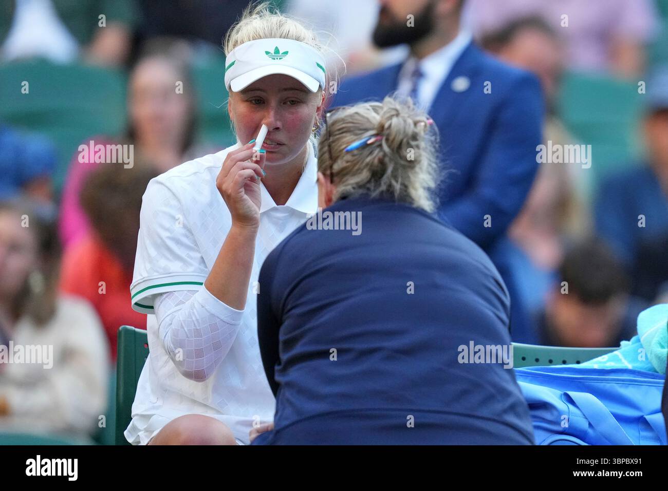 Clara Tauson of Denmark gets medical assistance during the women's ...