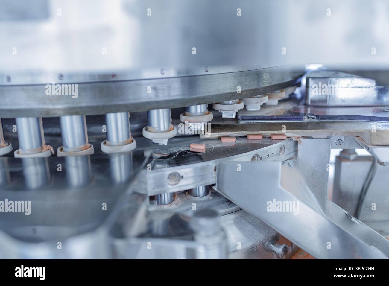 Automated machinery producing pharmaceutical tablets in a sterile ...