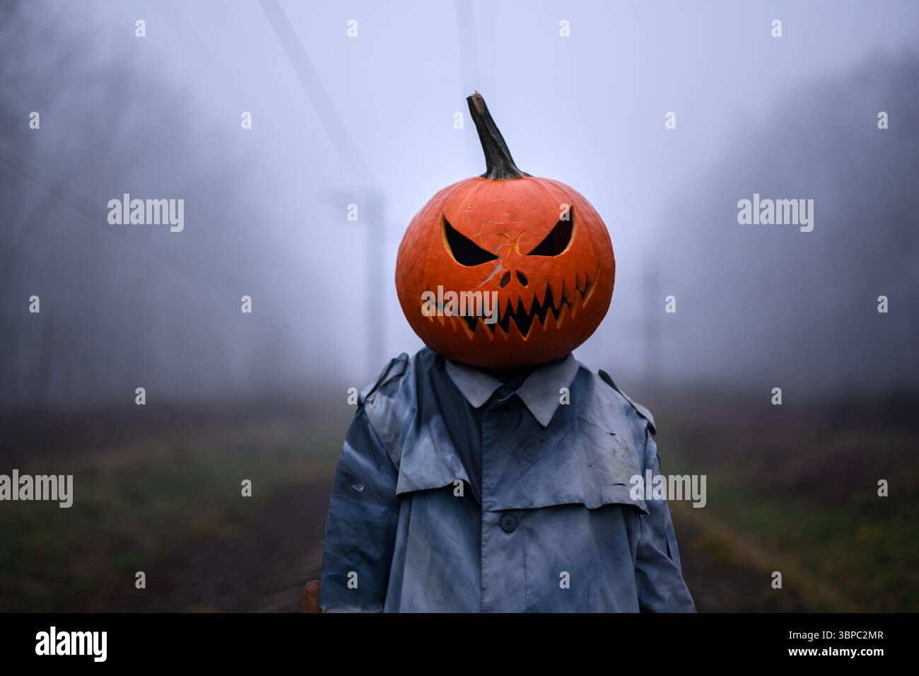 Creepy person wearing scary orange hi-res stock photography and images ...
