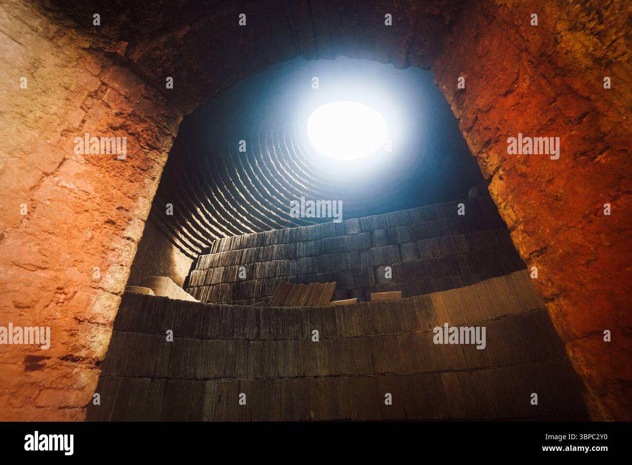 Traditional pottery kiln with stacked clay tile and smoke chimney ...