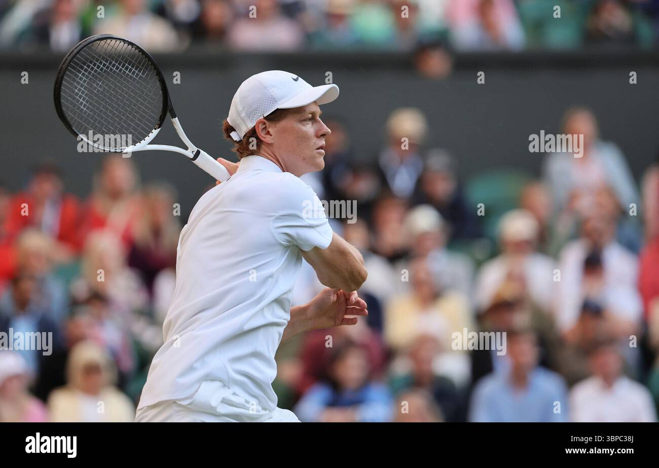 Jannik Sinner of Italy returns a shot to Grigor Dimitrov of Bulgaria during their men's singles ...