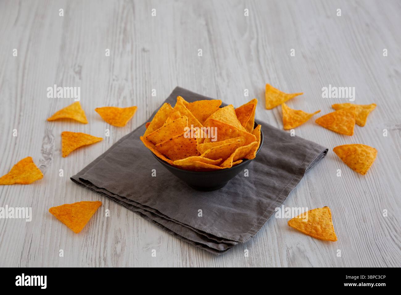 Crunchy Nacho BBQ Tortilla Chips in a Bowl, side view Stock Photo - Alamy