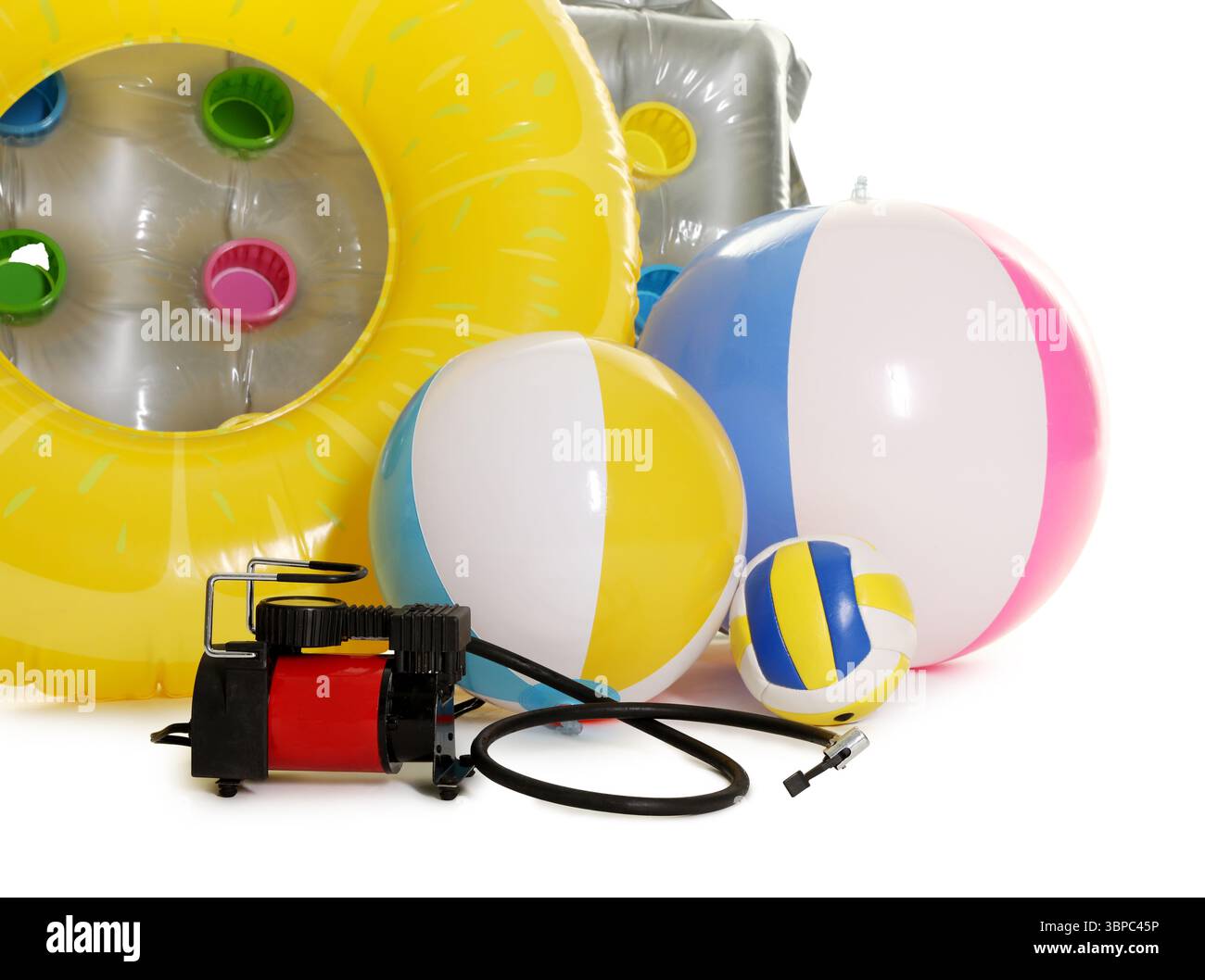 Inflatable ring, mattress, balls and air compressor isolated on white ...