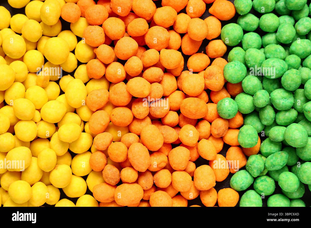 Colorful coated crunchy peanuts as background Stock Photo - Alamy
