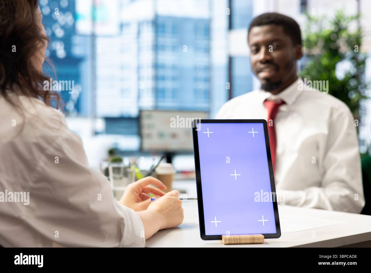 Recruiter using isolated screen tablet doing interview with person ...