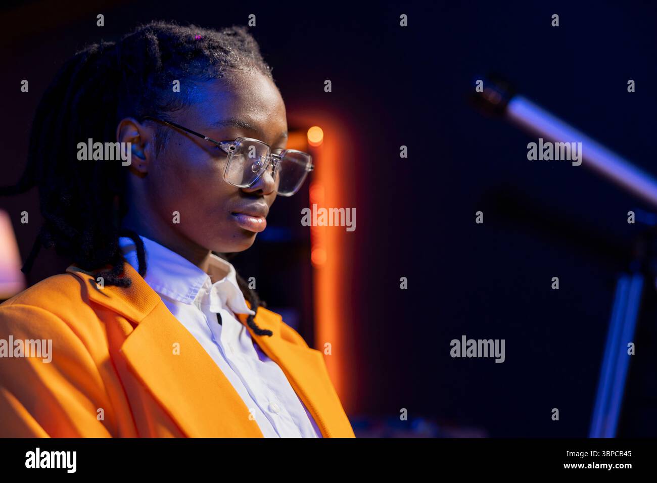 Teleworker in home office checking analytics statistical data sets on laptop. African american ...