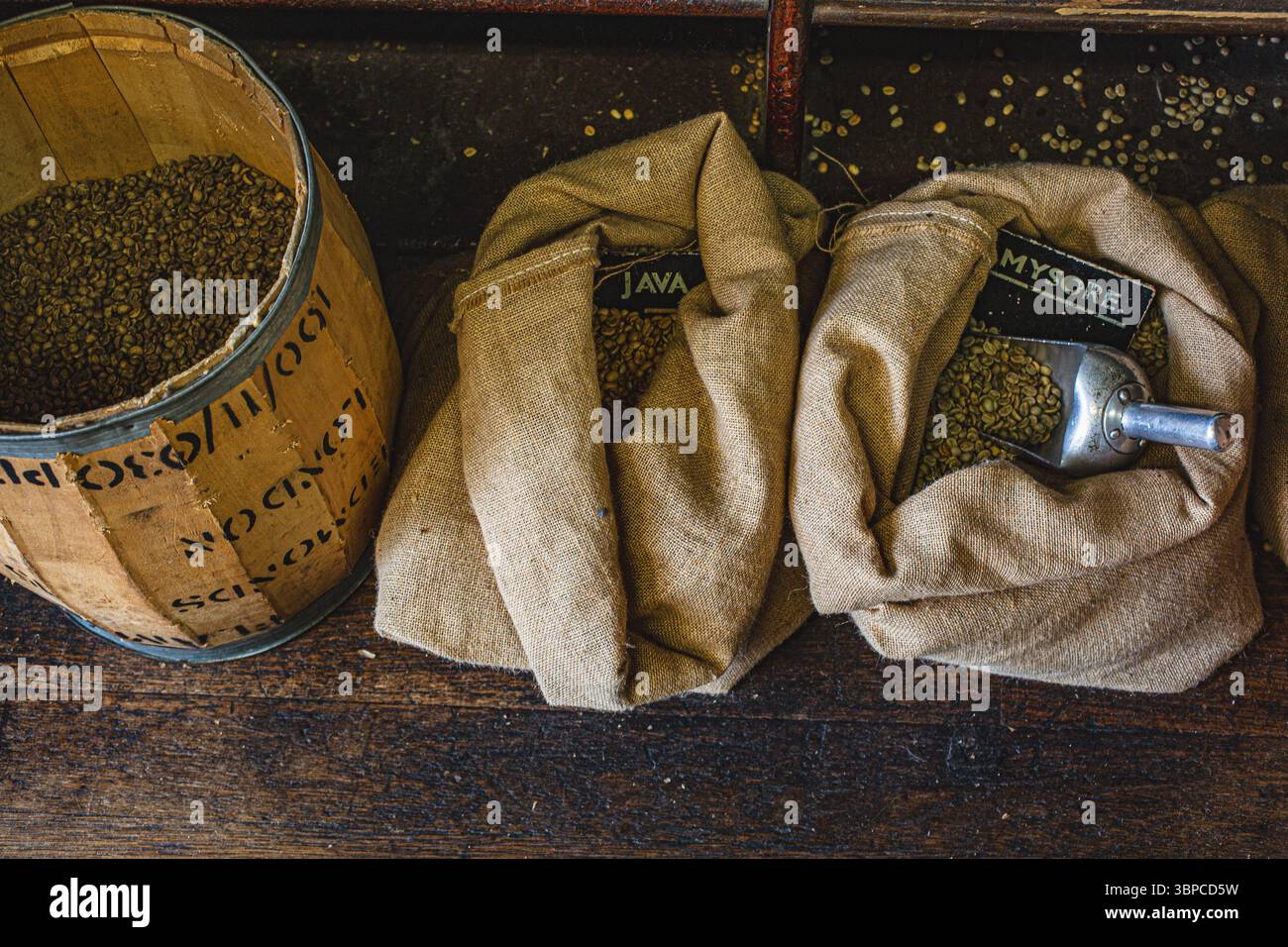 Coffee sacks filled with fresh coffee beans and metal scoop Coffee ...
