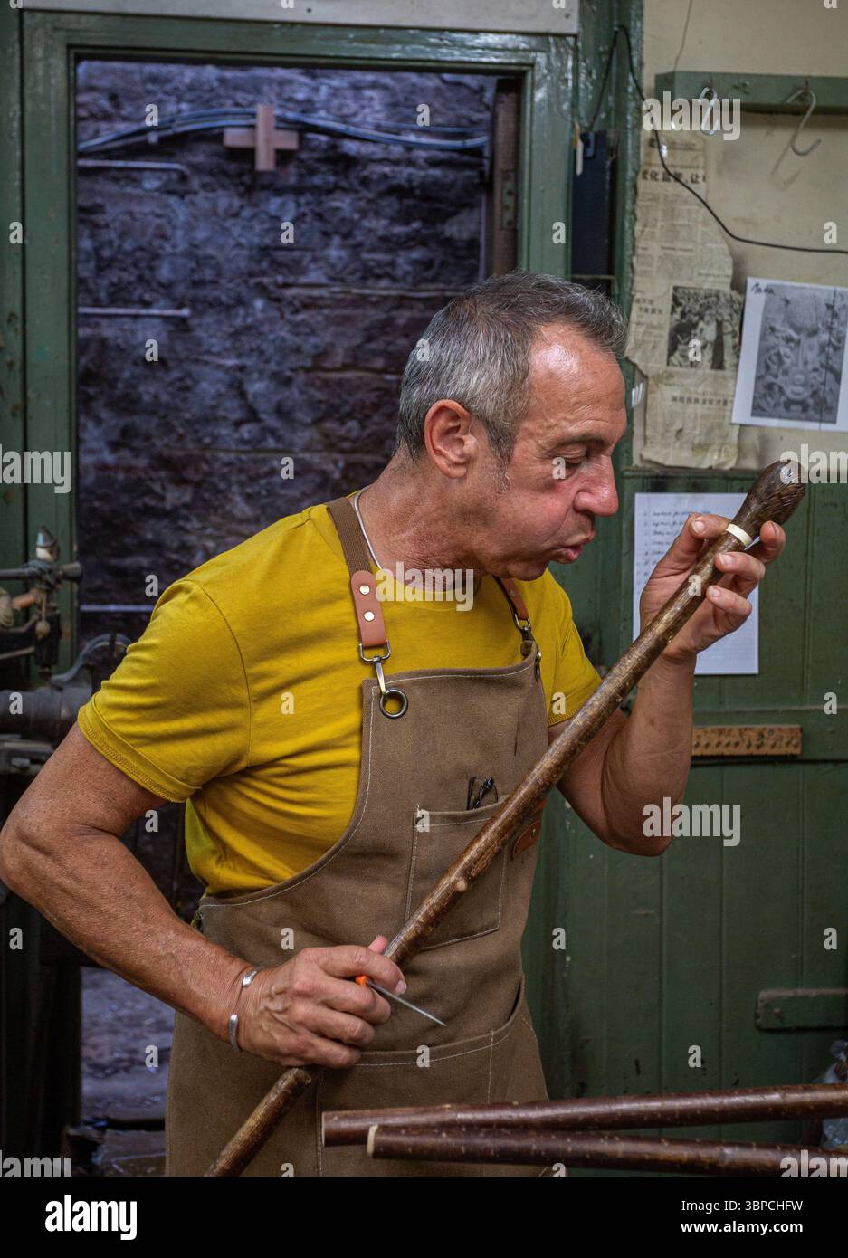 Craftsman making a walking stick at James Smith & Sons Umbrella shop ...