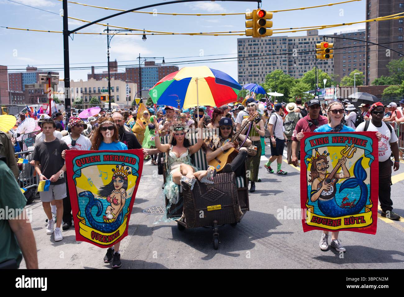 A vibrant Coney Island Mermaid Parade scene features participants ...