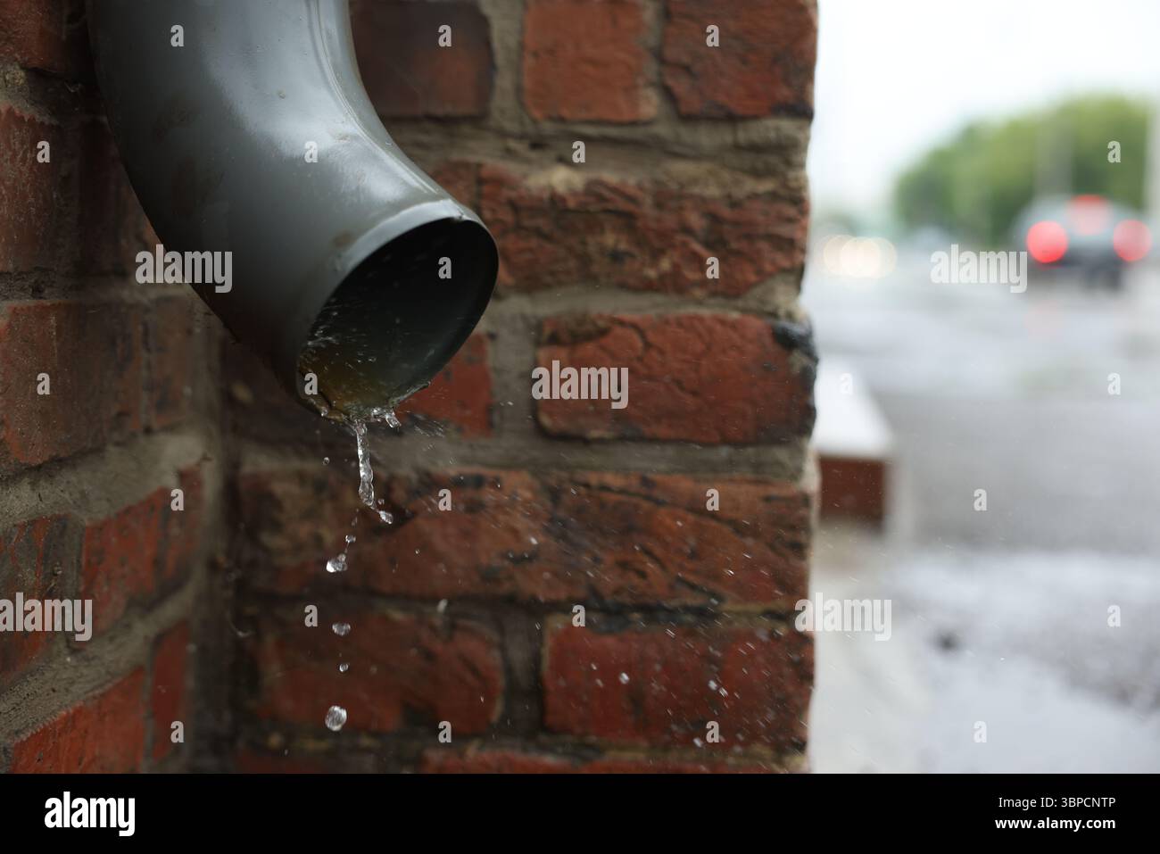 Water dripping from drain pipe outdoors, closeup Stock Photo - Alamy