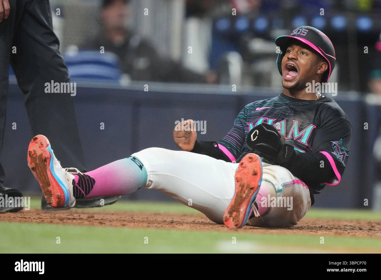 Miami Marlins' Xavier Edwards reacts after scoring on a single hit by ...