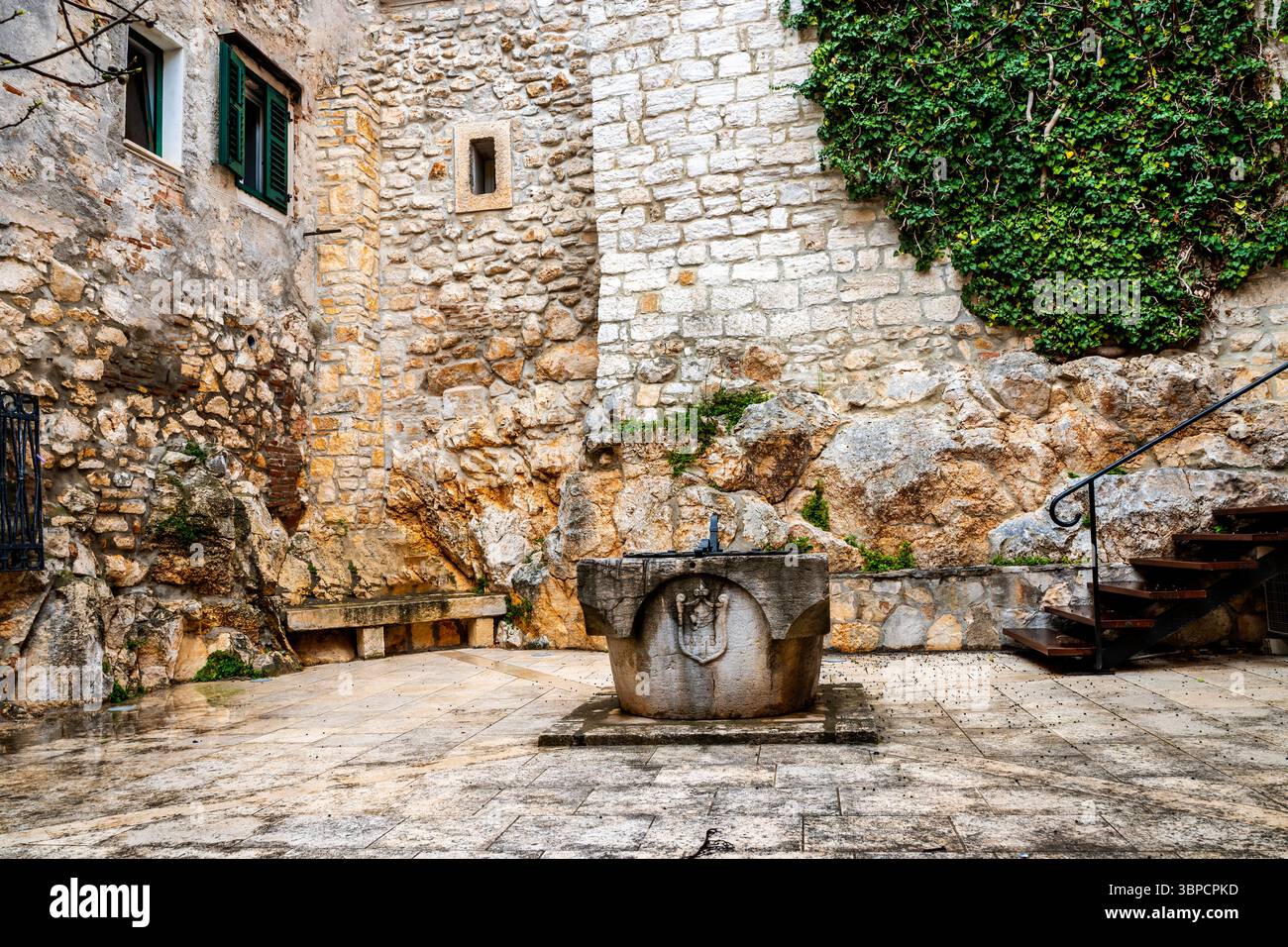 Medieval stone fountain in a stone courtyard in Rovinj, Croatia Stock ...
