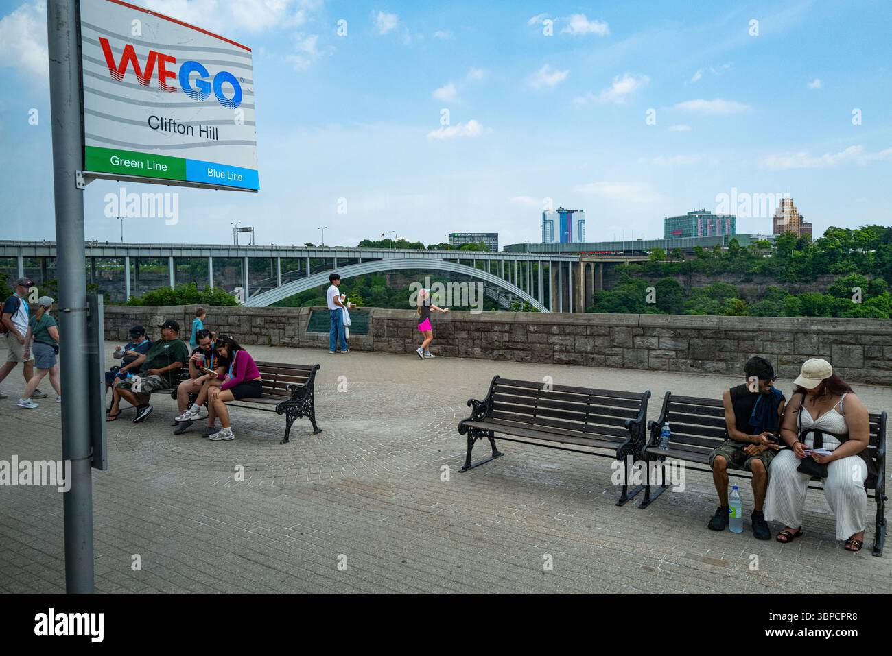 Tourists wait for the next WeGo bus at the Clifton Hill Stop near the ...