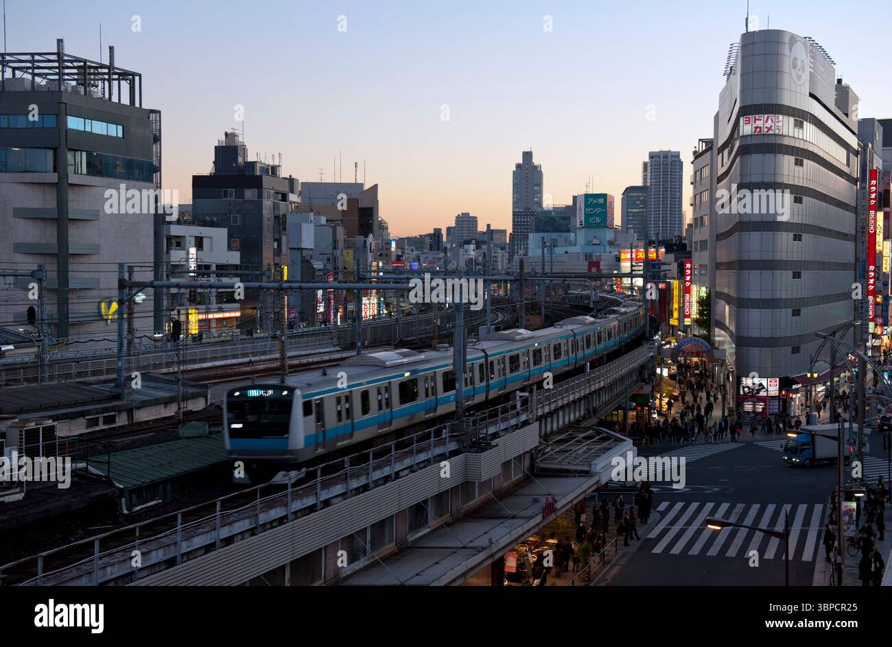 Evening cityscape view of JR (Japan Railway) Ueno Station and elevated ...