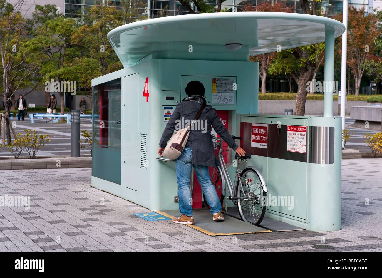 Automated bike parking kiosk machine for quickly stowing one's bicycle ...