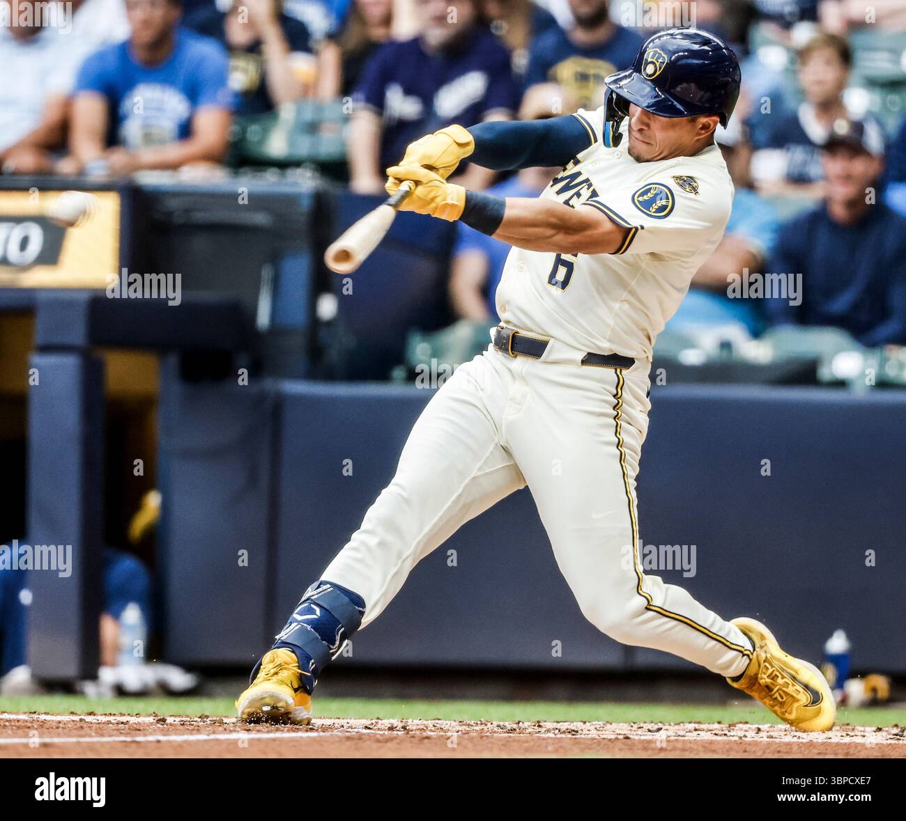 Milwaukee Brewers outfielder Isaac Collins hits a single in the first ...