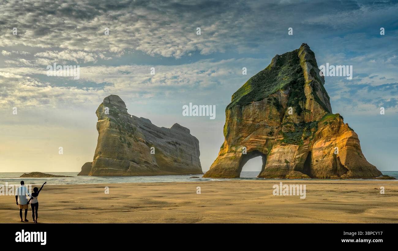 Two tourists enjoying the seaside scenery at the Archway islands on ...