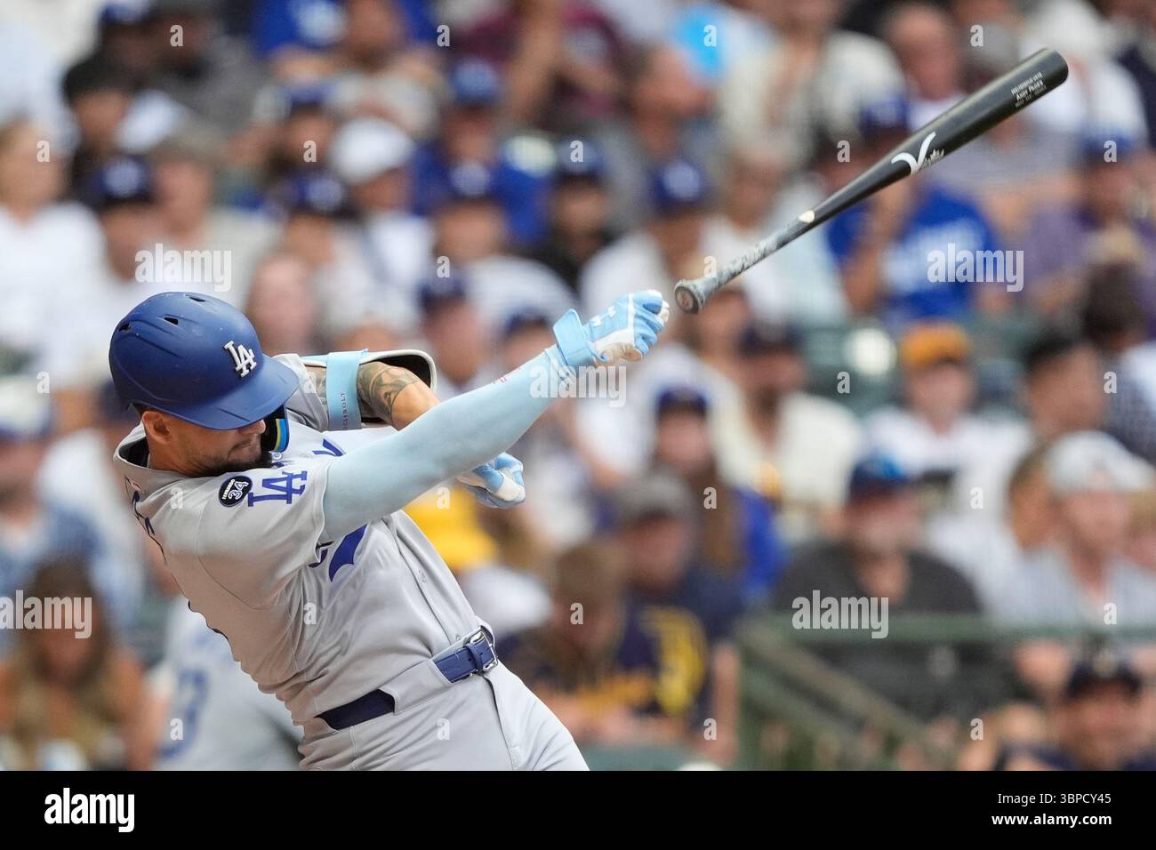 Los Angeles Dodgers' Andy Pages loses control of his bat on a swing ...